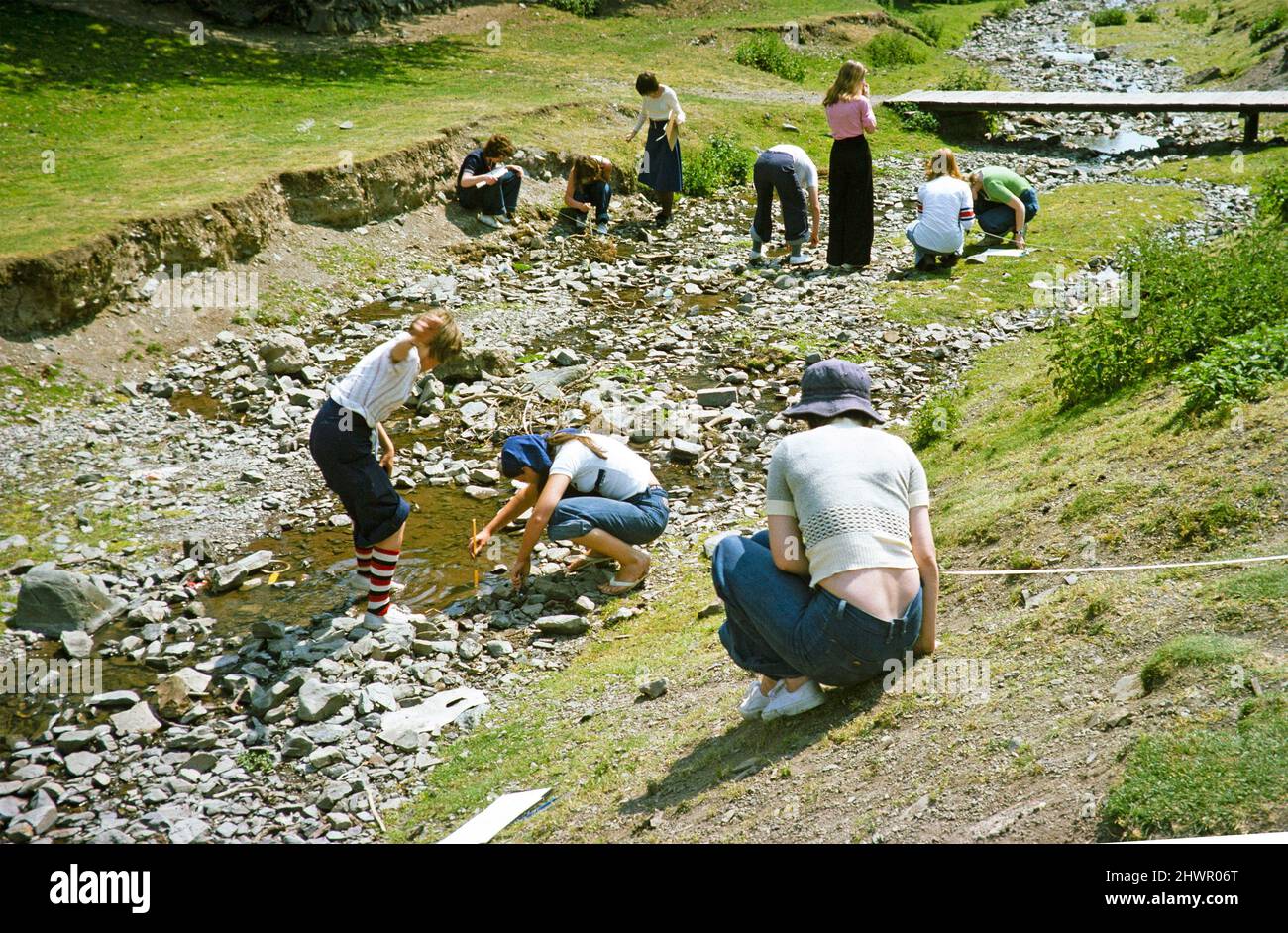 Female secondary school students engaged in geography fieldwork, UK ...
