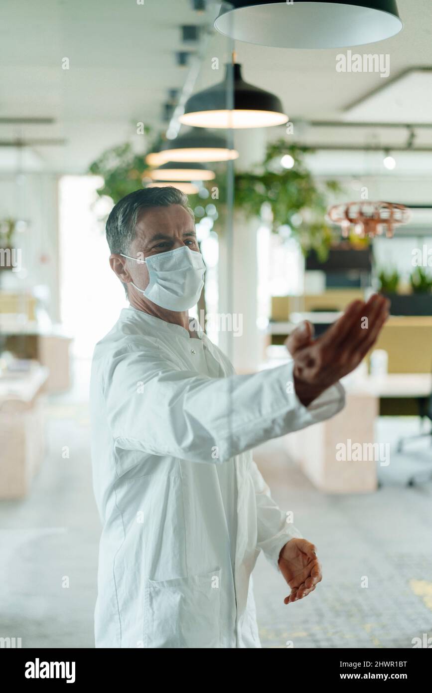 Engineer testing drone model at office seen through glass wall Stock ...