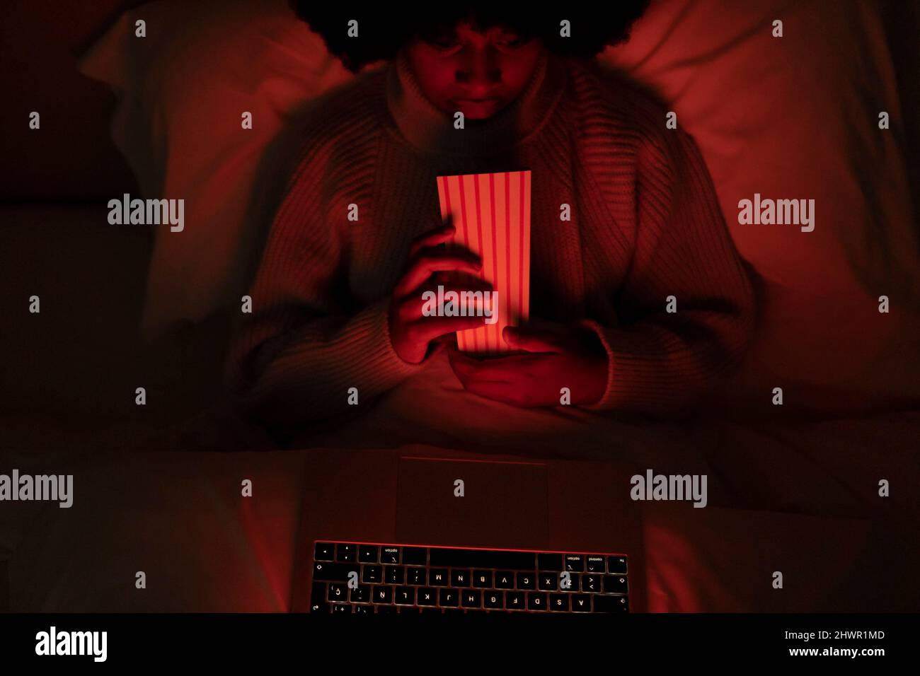 Women watching laptop in bed hi-res stock photography and images - Alamy