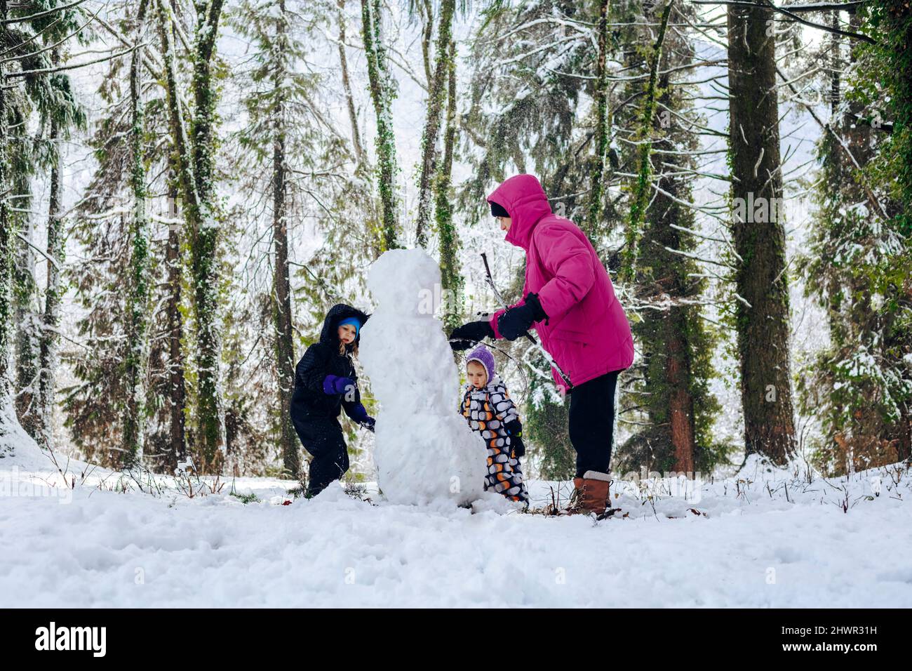 Snowman in the forest hi-res stock photography and images - Alamy