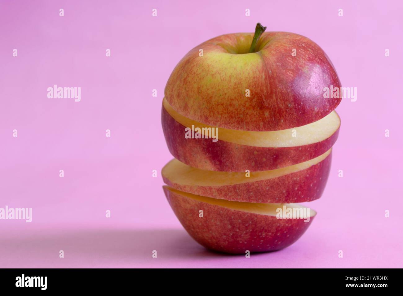 Floating levitating ripe apple on a pink background. Vitamins, healthy ...