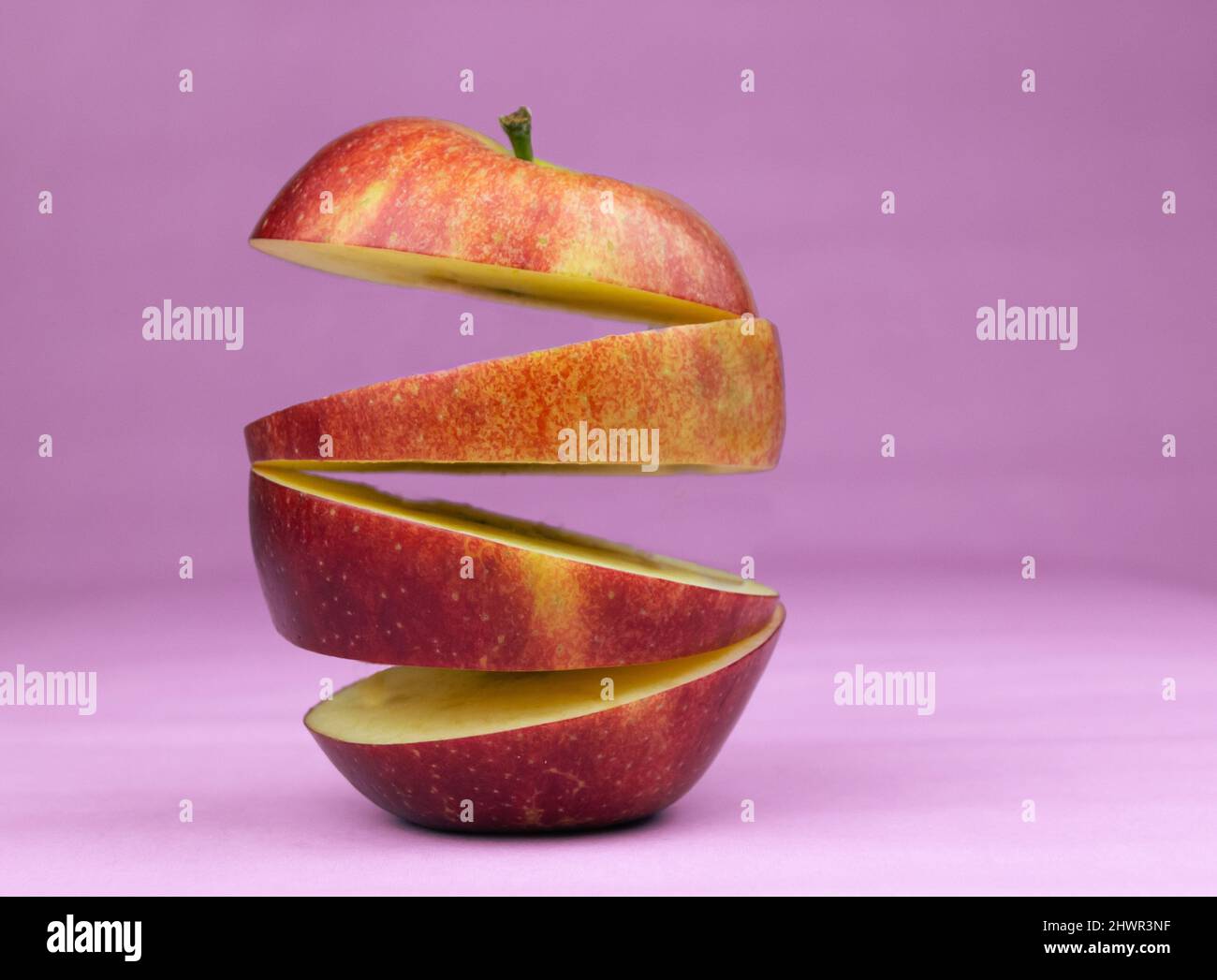 Floating levitating ripe apple on a pink background. Vitamins, healthy ...