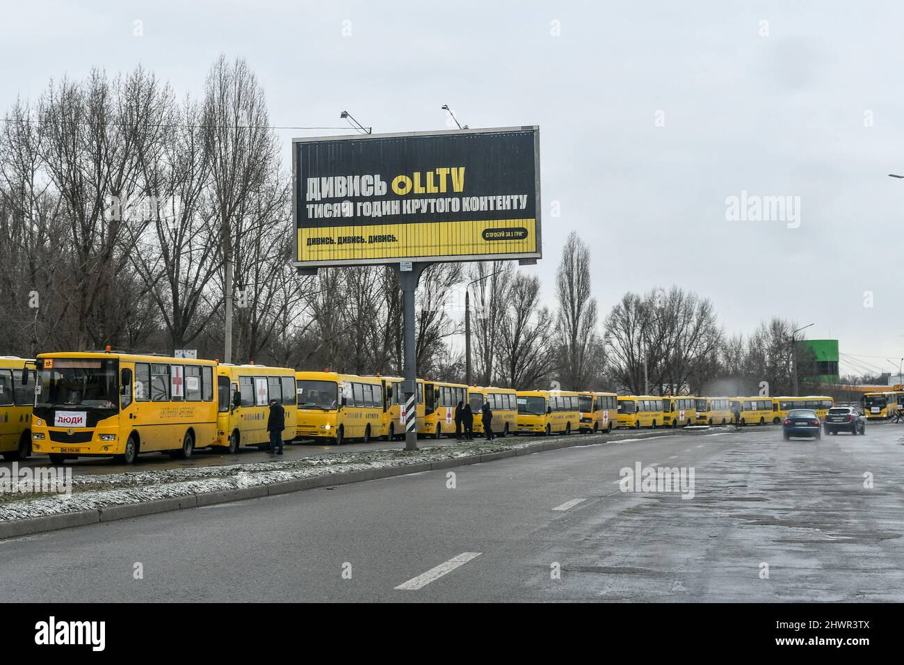 ZAPORIZHZHIA, UKRAINE - MARCH 6, 2022 - A convoy of buses is ready to ...