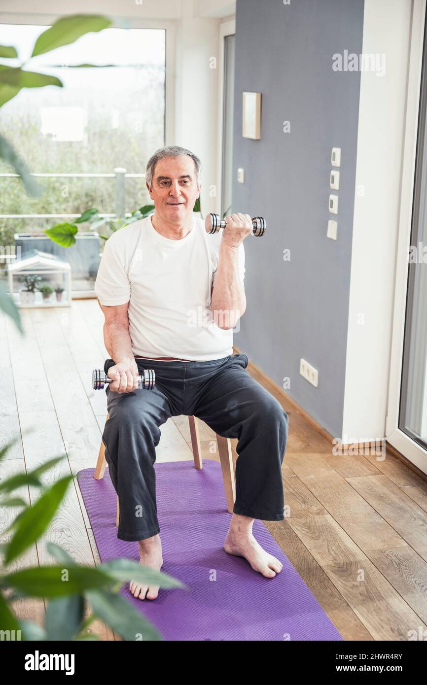 Gym exercise male home sitting chair hi-res stock photography and ...