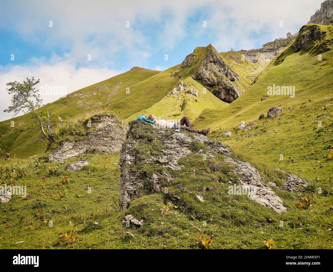 People resting on rock hi-res stock photography and images - Alamy