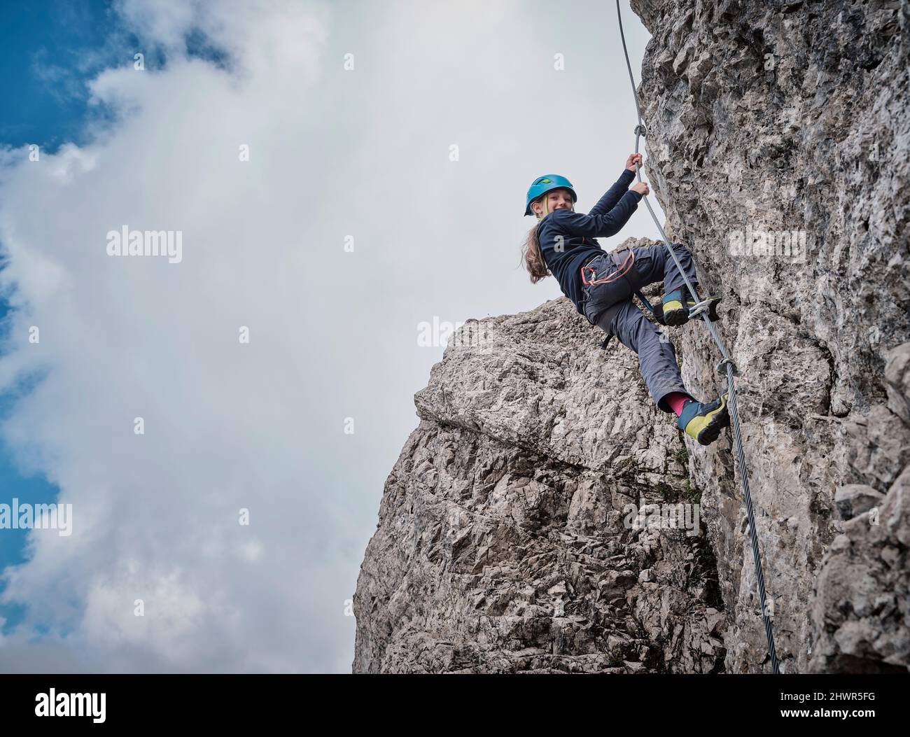 Happy girl climbing up hi-res stock photography and images - Alamy