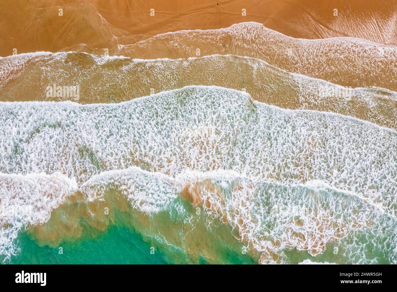 Aerial view of edge of sandy coastal beach Stock Photo - Alamy