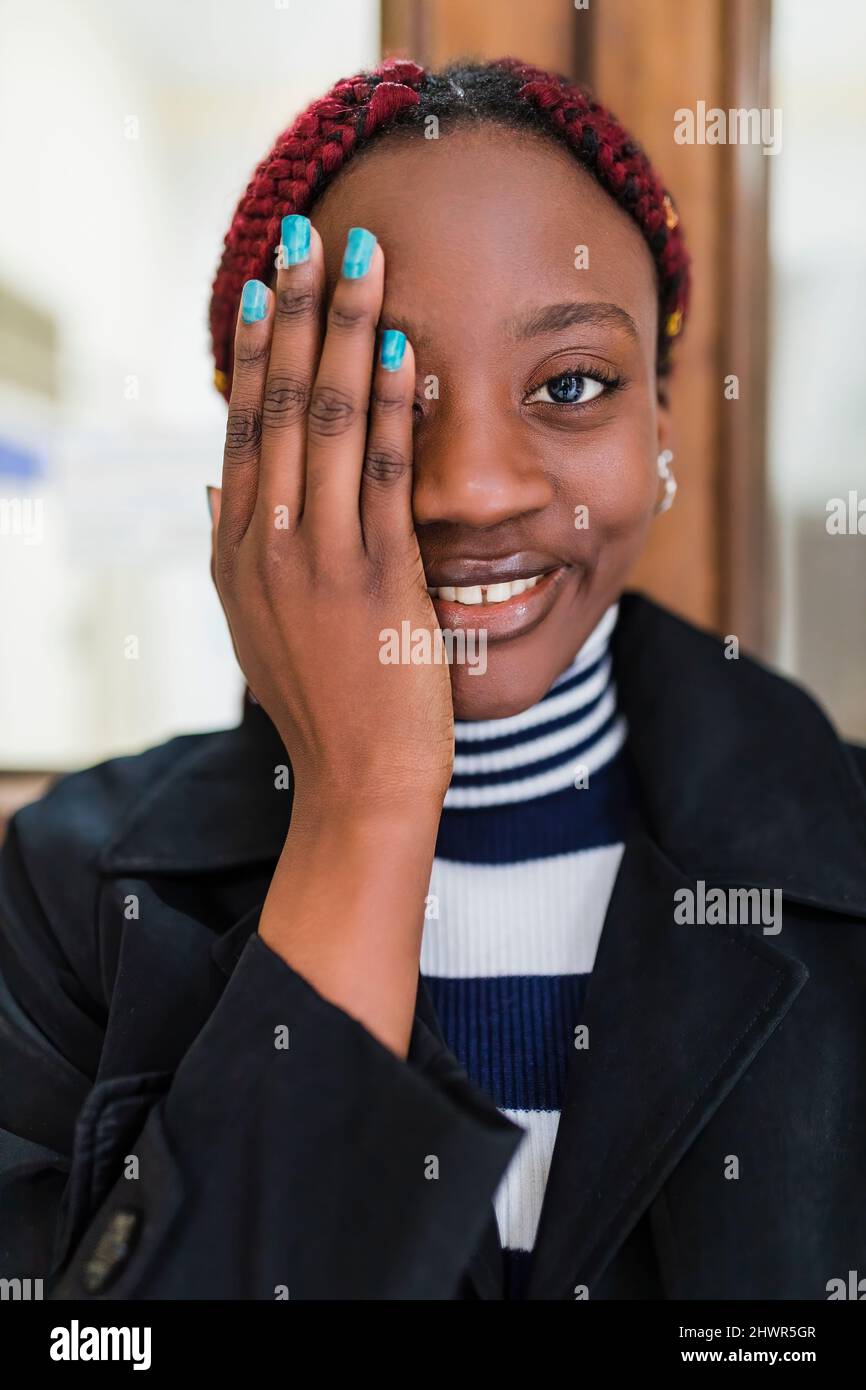 African descent hand covering face hi-res stock photography and images ...