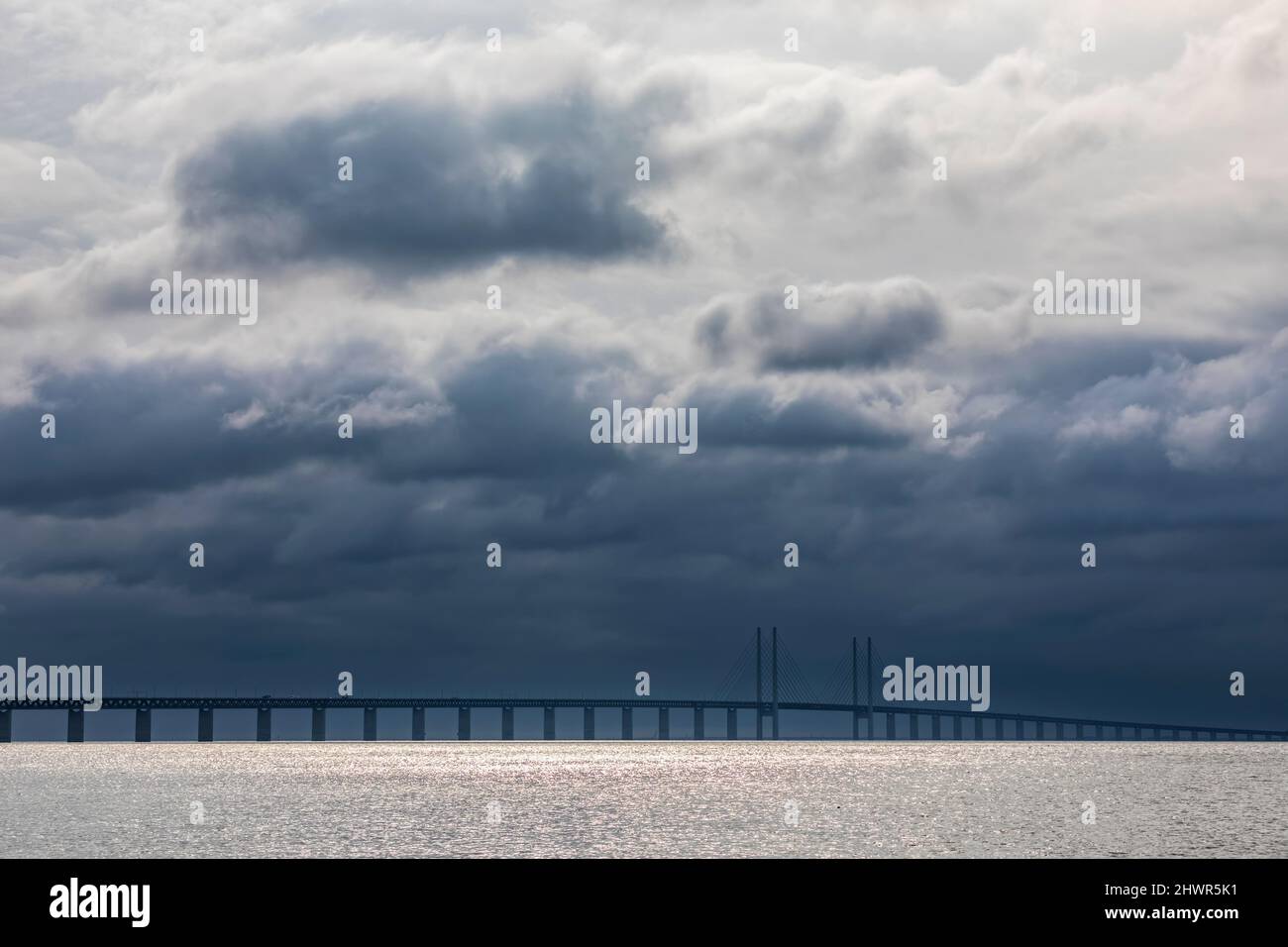 Cloudy sky over Sound strait with silhouette of Oresund Bridge in ...