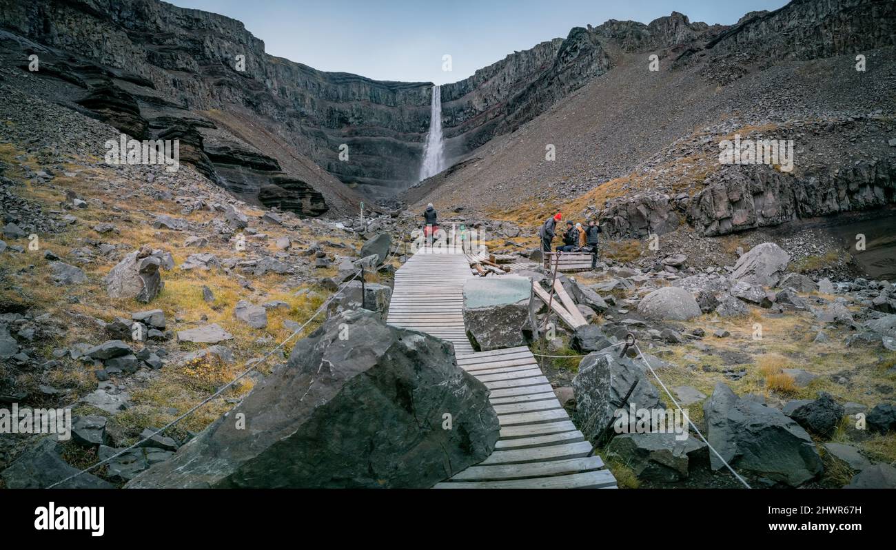 Hiking path to Hengifoss waterfall with blurred tourists Stock Photo ...