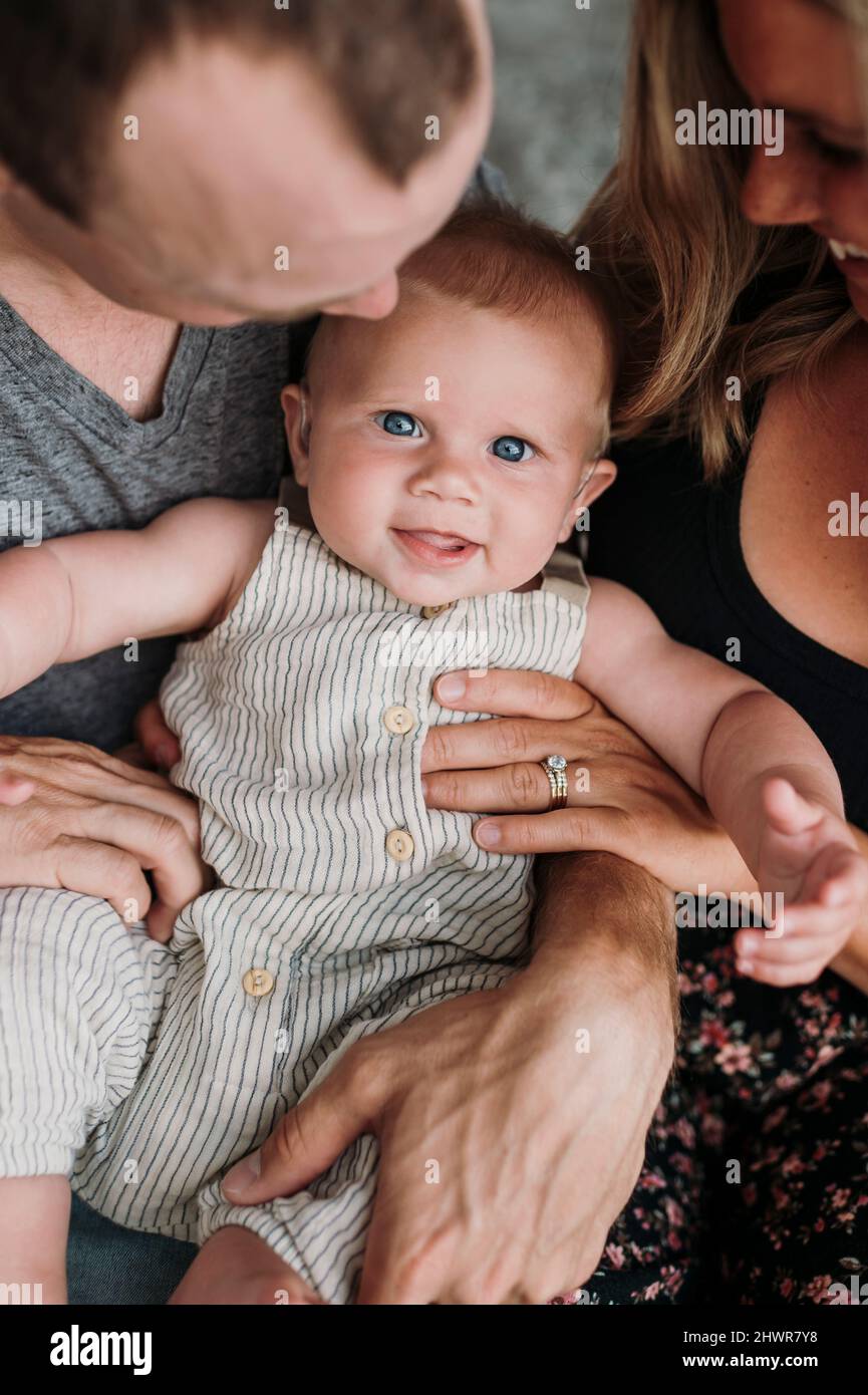 Happy parents with cute son Stock Photo - Alamy