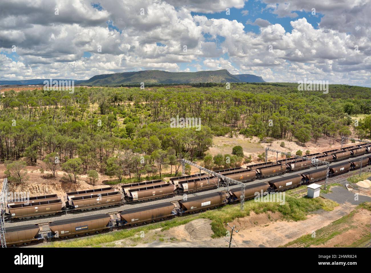 Aerial of coal trains carrying 10,000 tons of coal passing through ...