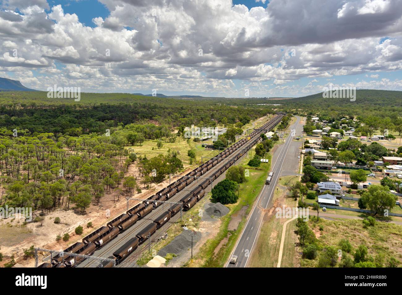 Aerial of coal trains carrying 10,000 tons of coal passing through ...