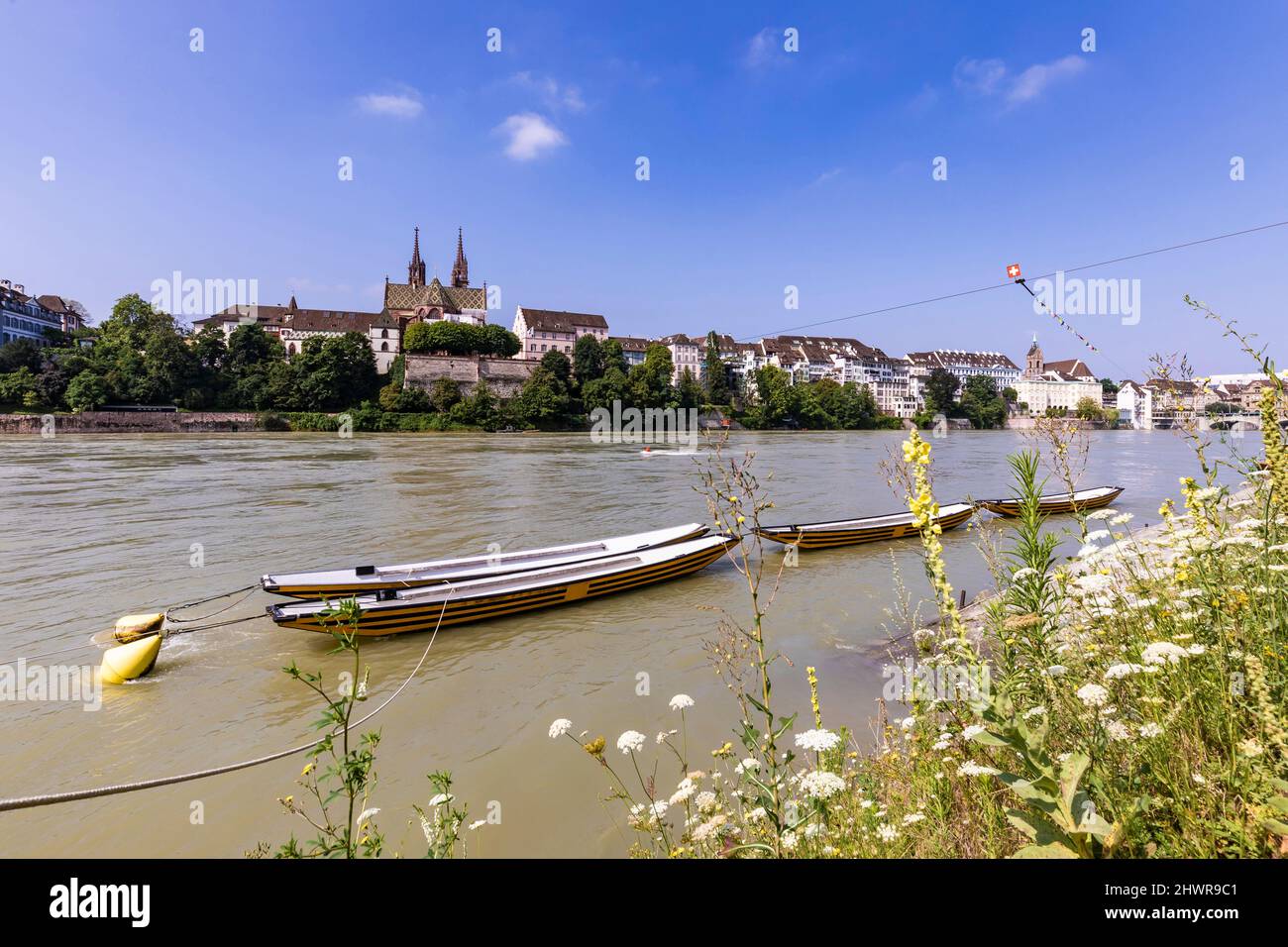 Switzerland, Basel-Stadt, Basel, Rowboats moored on bank of Rhine river ...