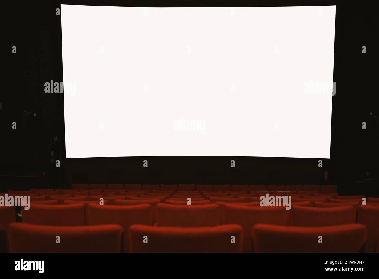 Movie theatre with empty armchairs and empty movie screen Stock Photo ...