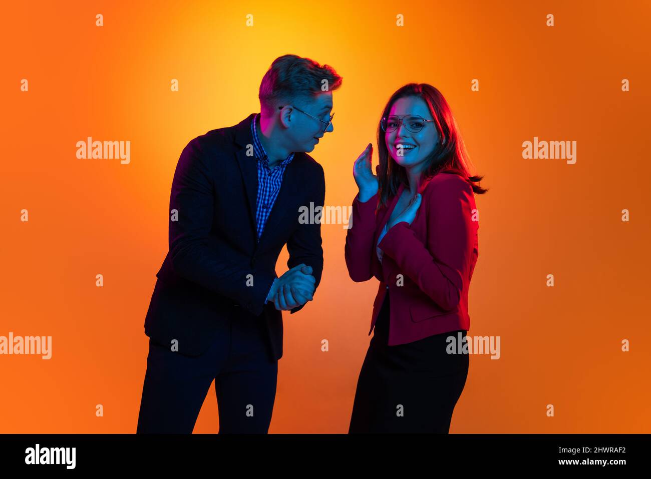 Portrait of two young people, man and woman actively talking, discussin ...