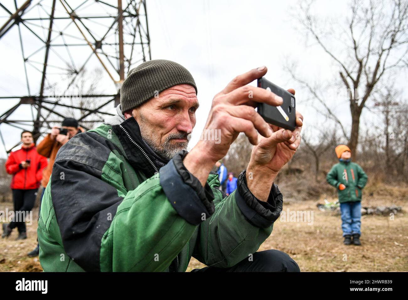 ZAPORIZHZHIA, UKRAINE - MARCH 6, 2022 - A man captures the burning of ...