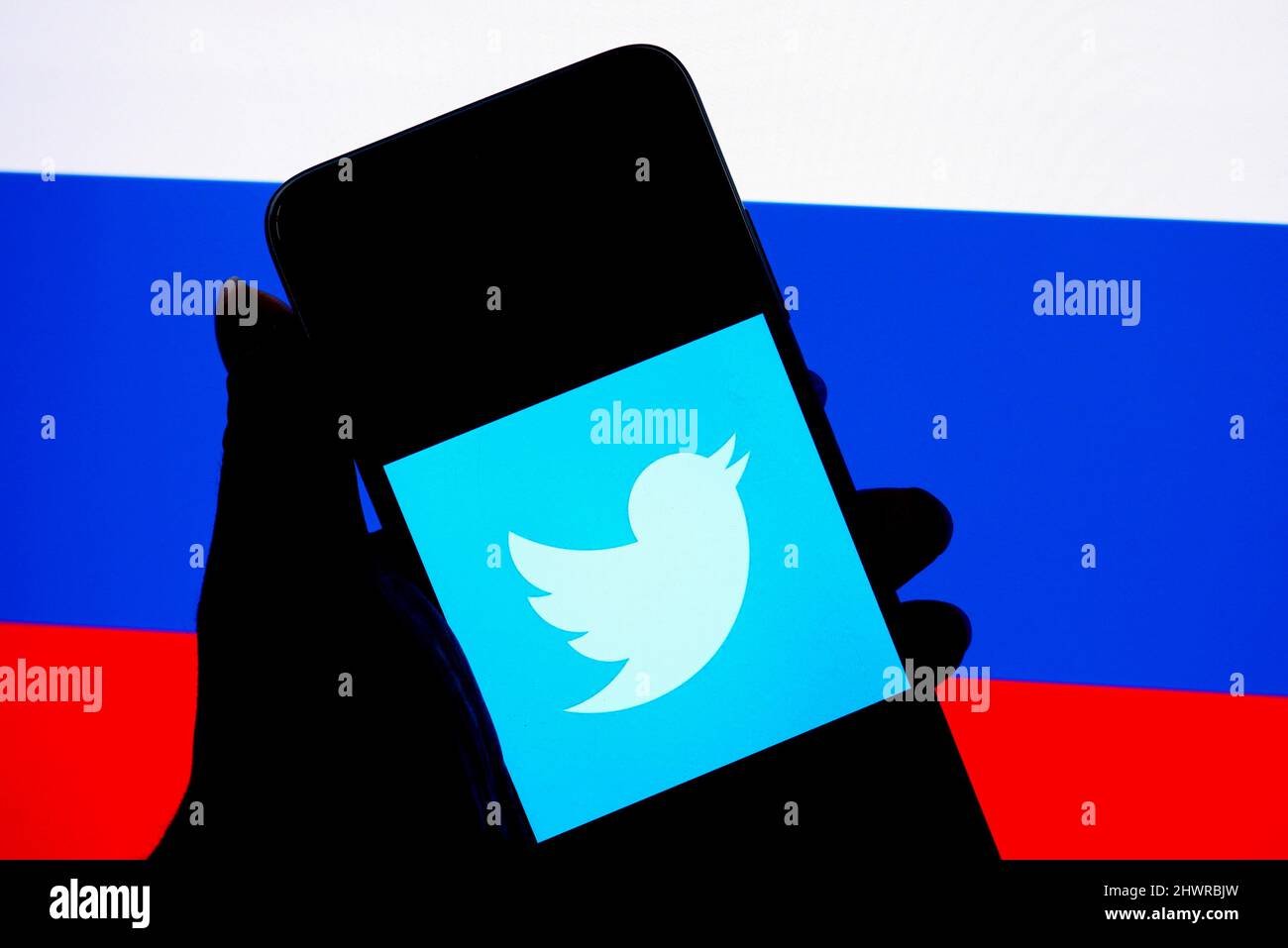 In this photo illustration a Twitter logo seen displayed on a ...