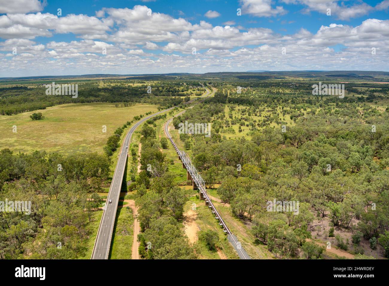 Aerial of the road and railway bridges crossing the Comet River Central ...