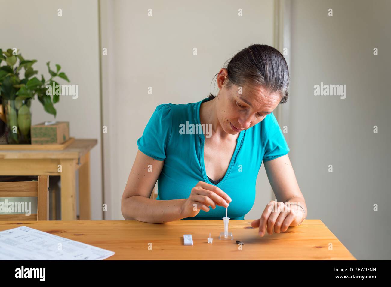 RAT test at home. Step 5. Insert the swab into the tube until the soft ...