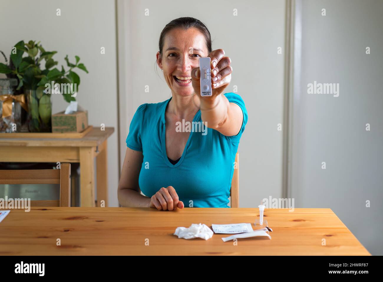 RAT test at home. Step 8. Happy woman showing negative Rapid antigen ...