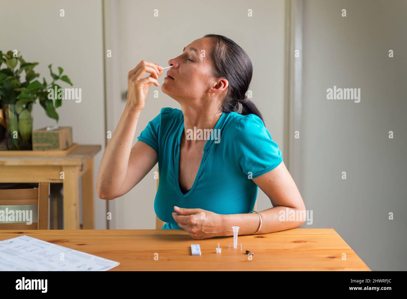 RAT test at home. Step 4. Insert cotton tip in your nostril and take a ...