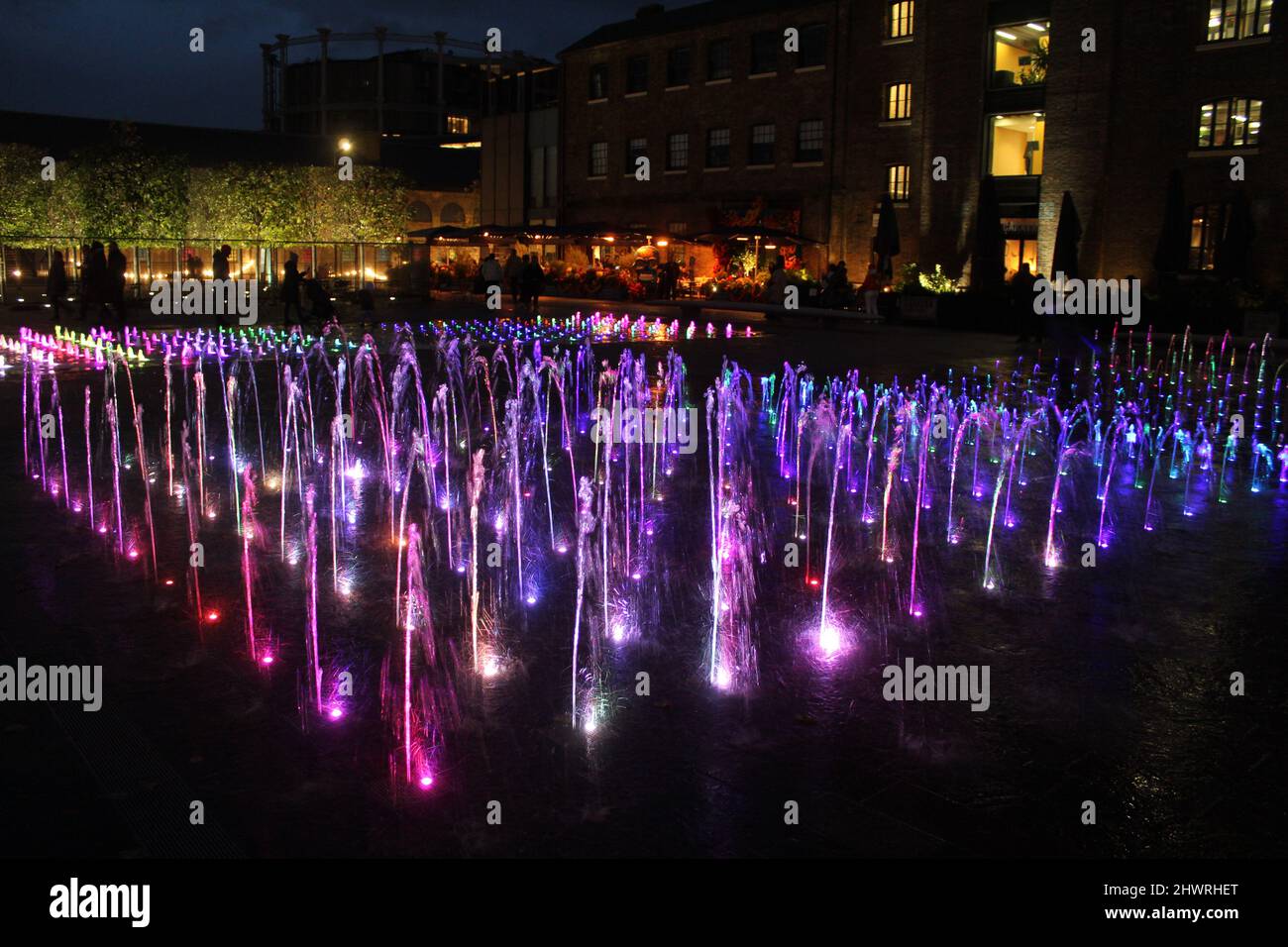 London's Granary Square fountain and neon colorful lights Stock Photo ...