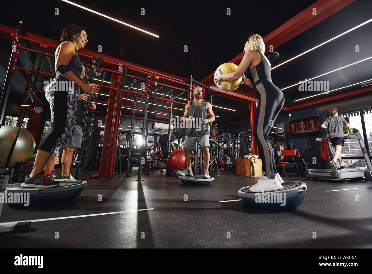 The guy tries to keep his balance on the balancing platform. Massive ...