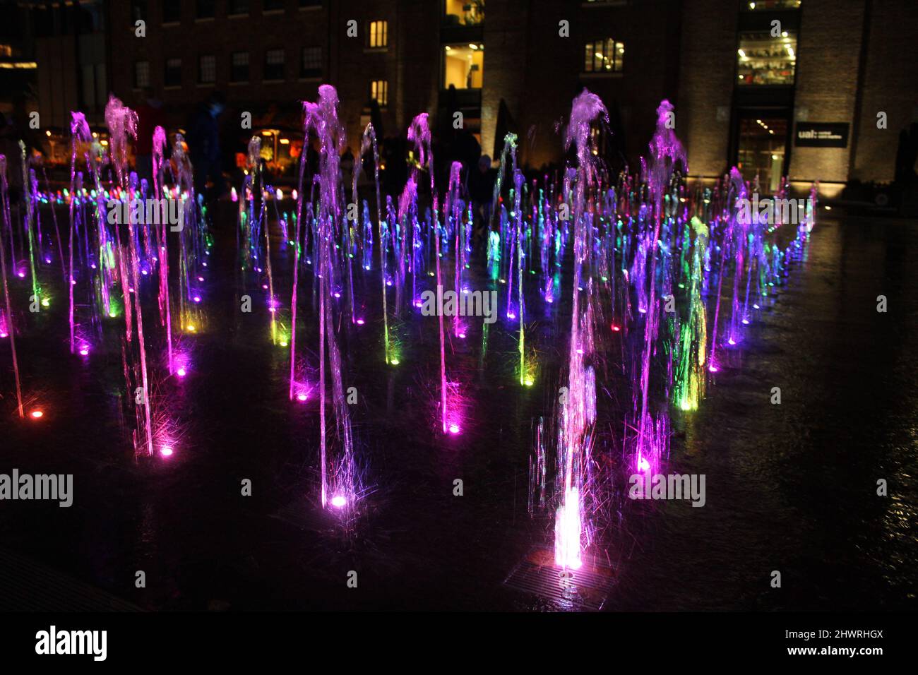 London's Granary Square fountain and neon colorful lights Stock Photo ...