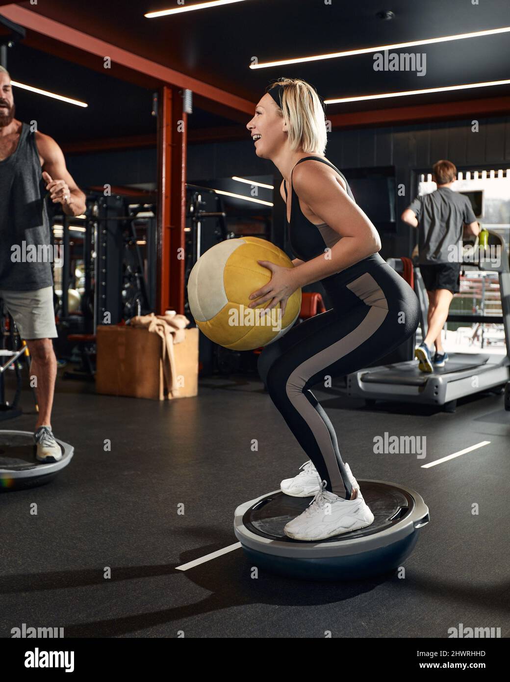 The guy tries to keep his balance on the balancing platform. Massive ...