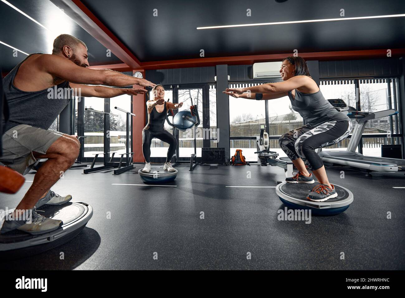 The guy tries to keep his balance on the balancing platform. Massive ...