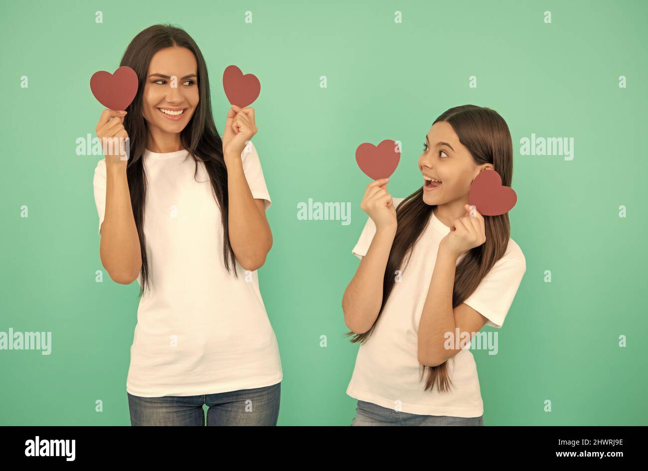 celebrating valentines day. child with mom. heart symbol of love ...