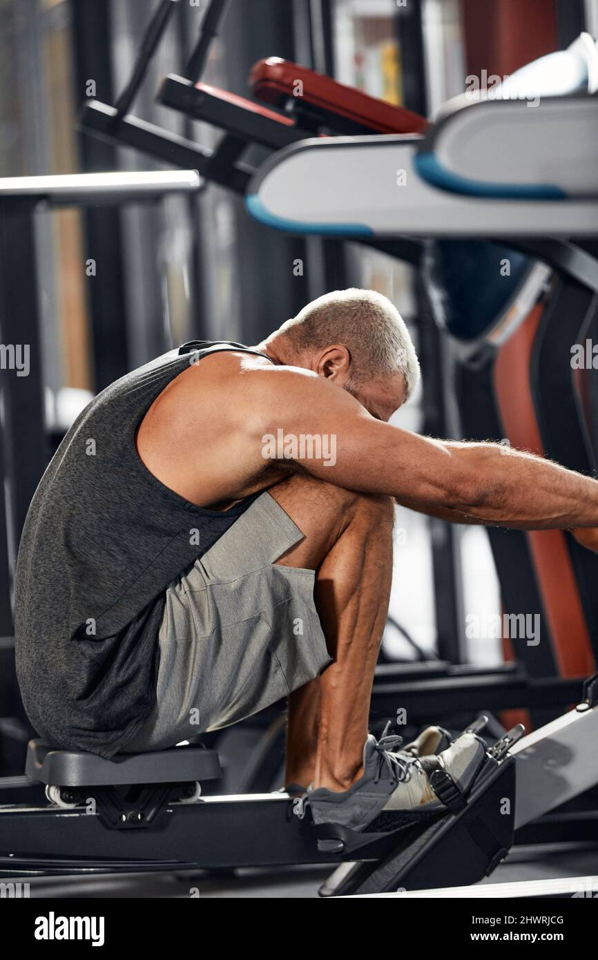 Training legs in the simulator, the athlete works with his legs on the ...