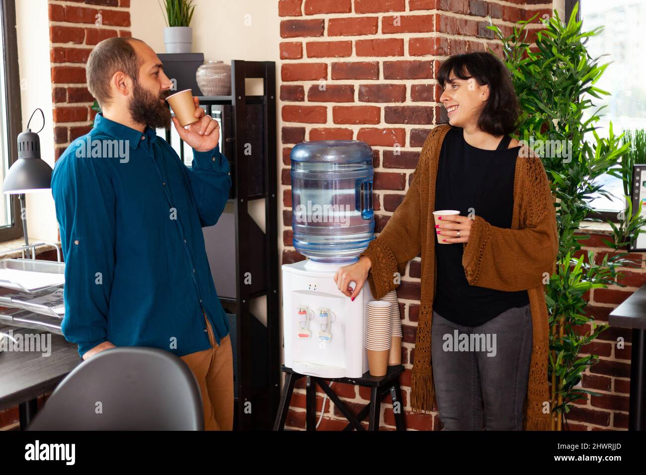 Water cooler office man woman hi-res stock photography and images - Alamy
