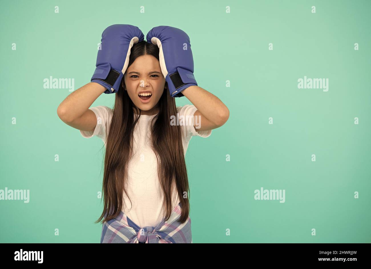 unhappy failed kid boxer in boxing gloves during sport training, copy ...