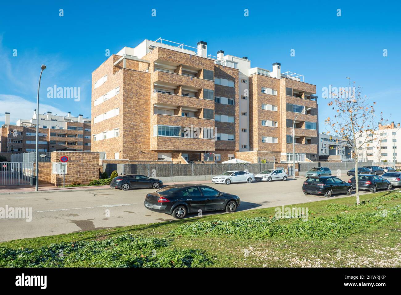 Facade of a residential building with exposed brick and large common ...