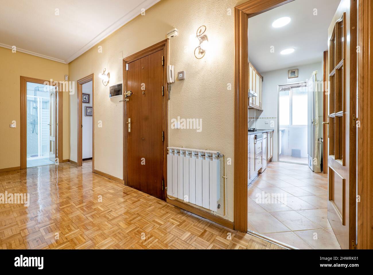 Hall of a residential house with aluminum radiator, parquet floors and ...