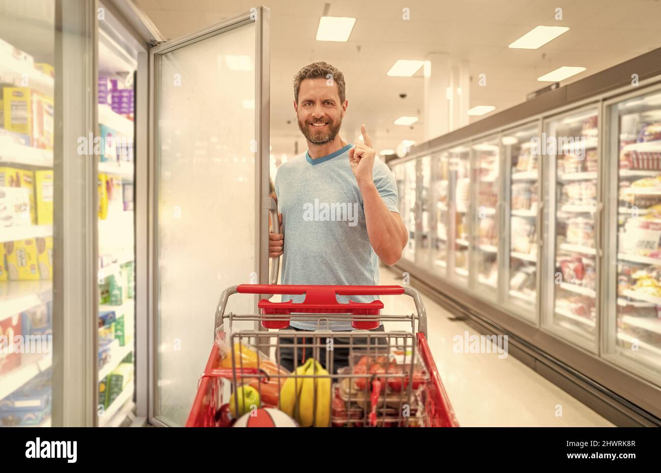 inspired with idea. customer consumer with purchases. guy at grocery ...