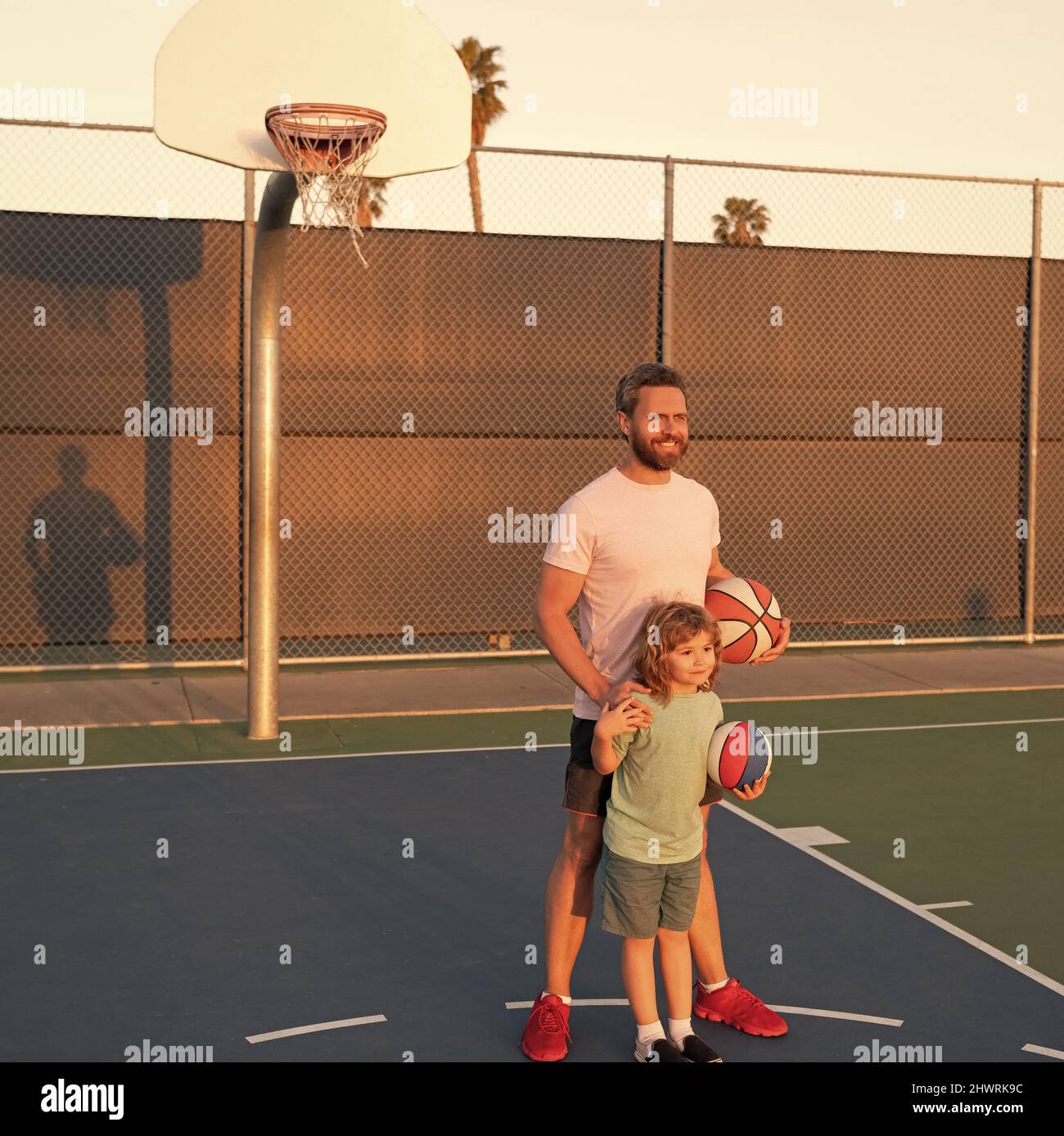 child hold sport ball. childhood and fatherhood. young player with ...