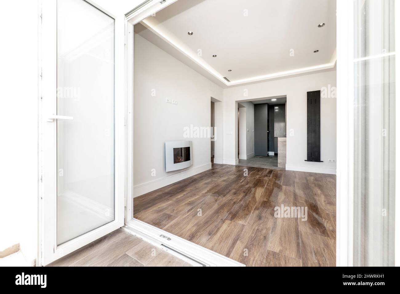 Apartment living room seen from the terrace with the folding glass ...