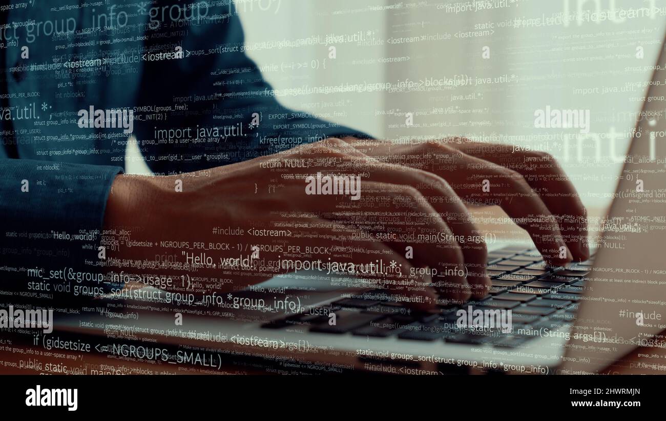 Computer Programmer Uses Capable Laptop Computer To Develop Programming Code Of New Software