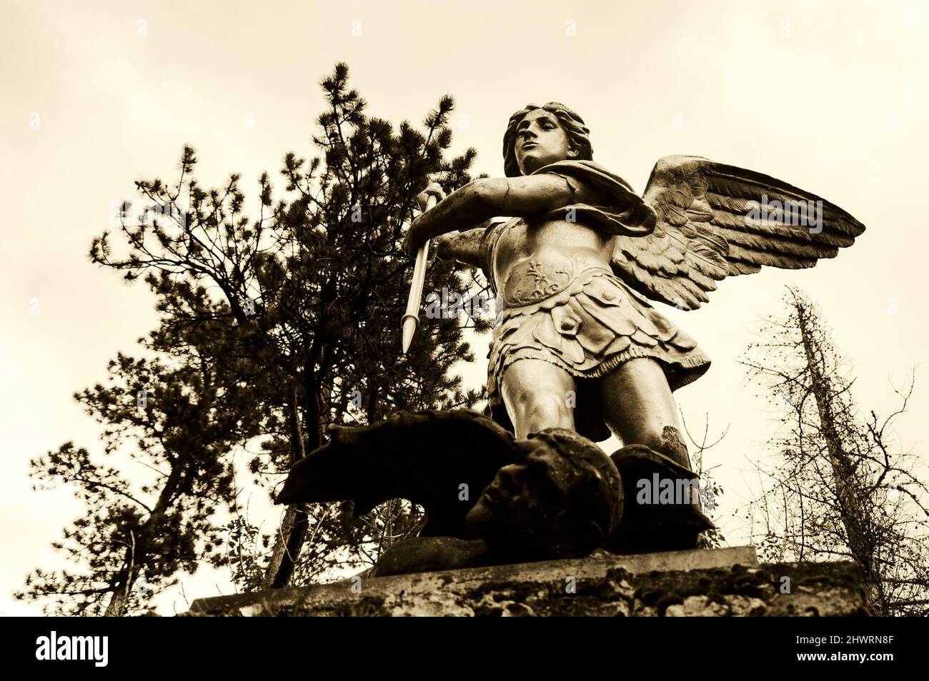 Saint Michael defeats Satan. Park sculpture in Annecy lake area. Duingt ...