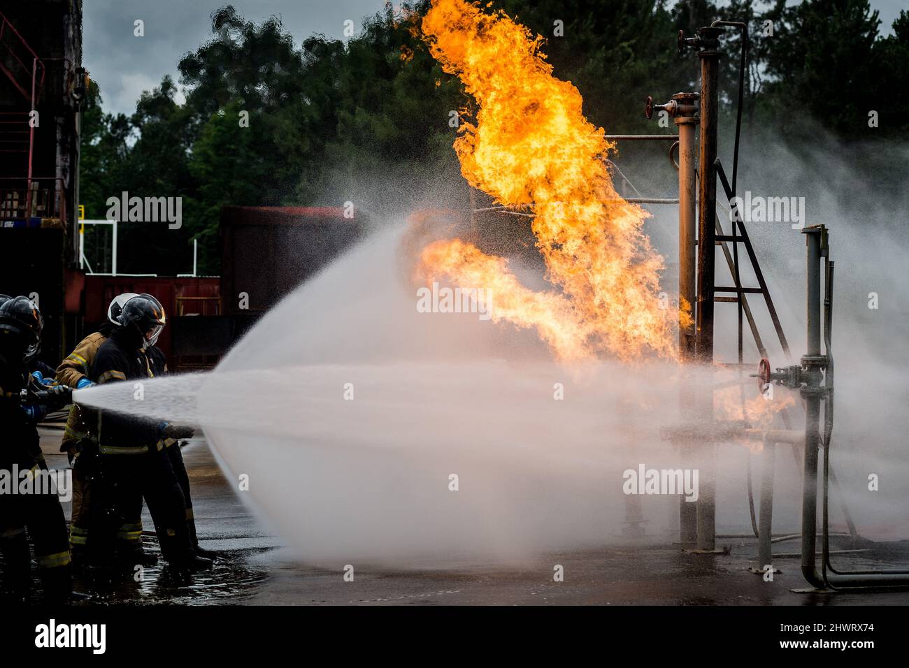 Putting out flame hi-res stock photography and images - Alamy