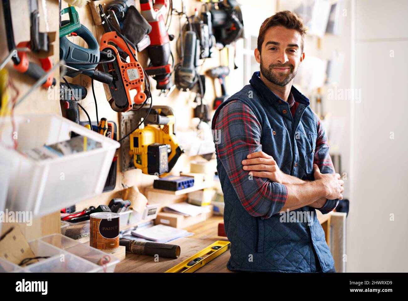 Lets fix it. Portrait of a handsome young handyman standing in front of ...