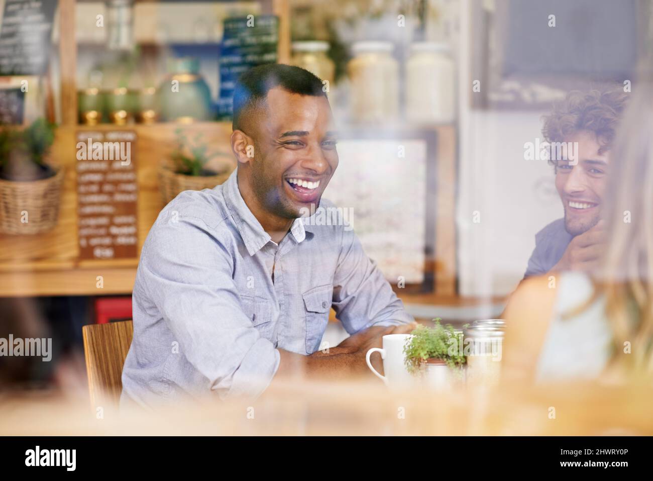 Catching up with his mates. Shot of a group of friends hanging out in a ...