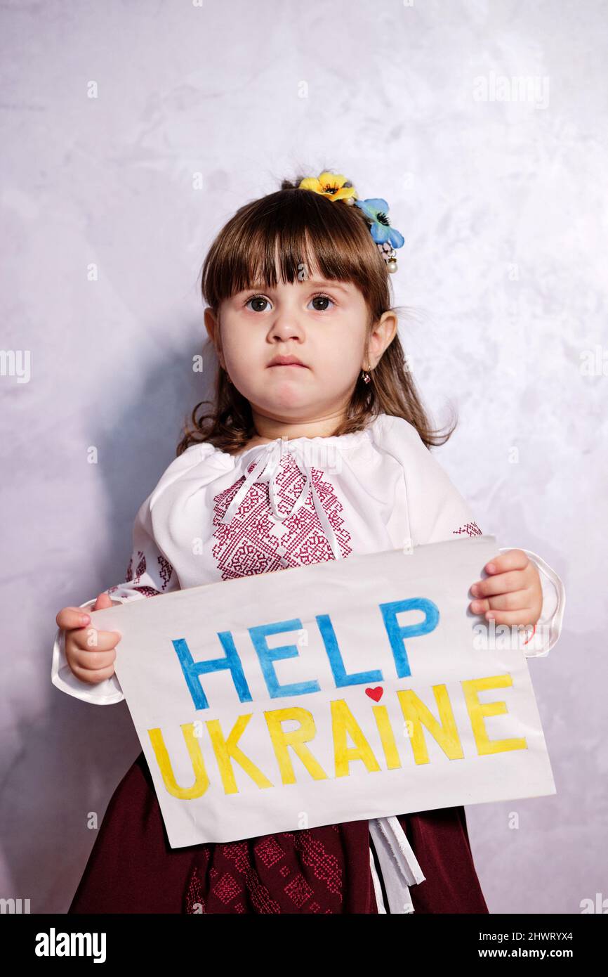 Sad toddler Ukrainian girl kid in embroidery dress protesting war ...
