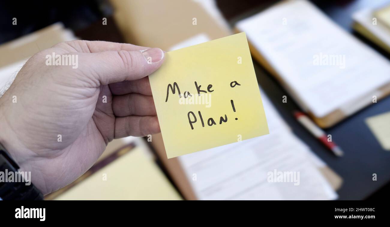 Sticky Note in Hand Businessman Desk Files Folder Working Message ...