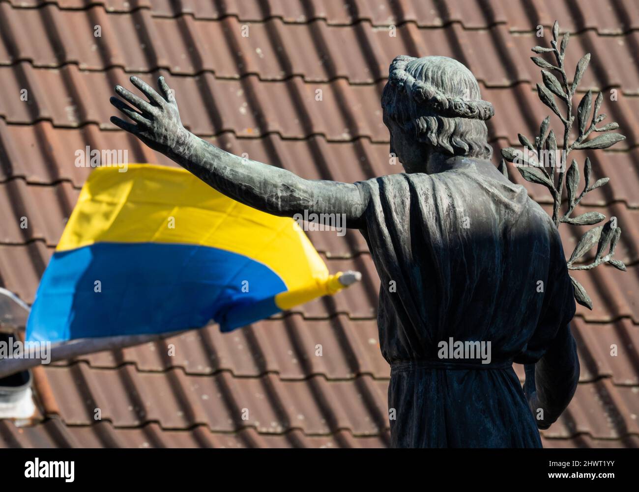 Hanau, Germany. 07th Mar, 2022. A Ukrainian flag waves from a skylight ...