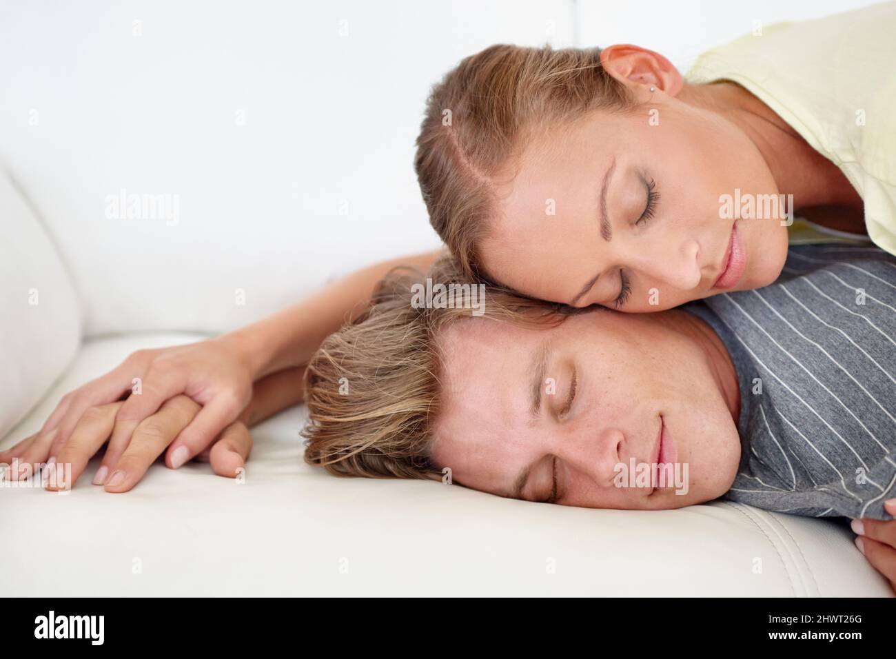 Having a couple nap. A woman lying on her mans back Stock Photo - Alamy