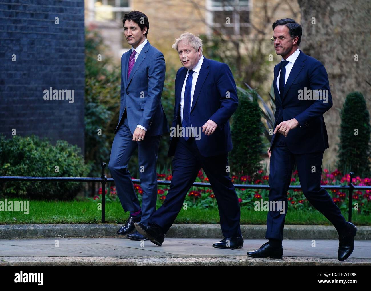 Prime Minister Boris Johnson (centre) arrives in Downing Street, London ...